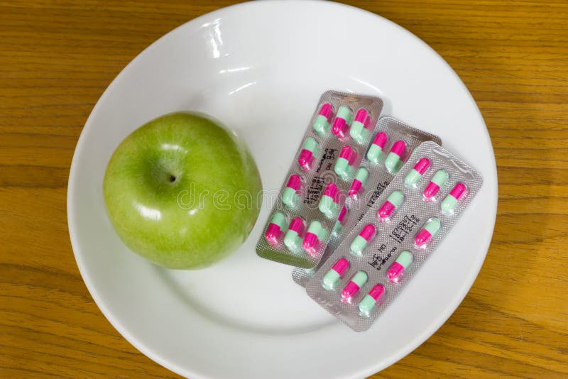 Apple and pills stock image. Image of pharmaceutical - 39049379