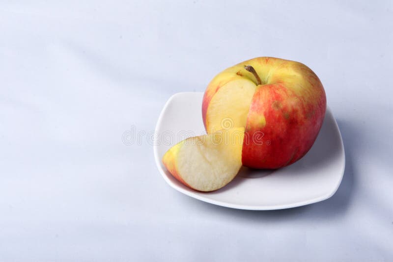 Apple on plate stock photo. Image of serving, crunchy - 4790504