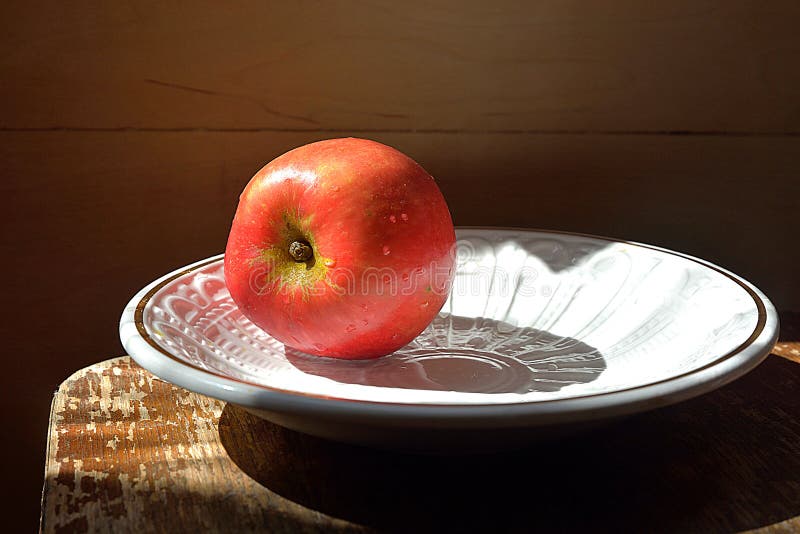 Apple on the plate stock photo. Image of apple, white - 58294156