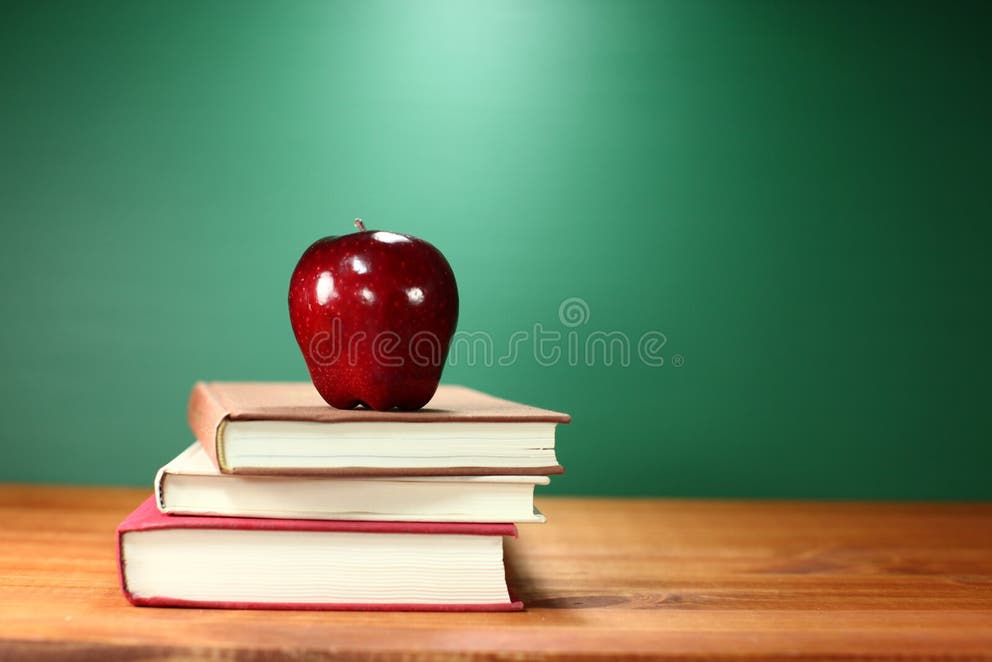 Apple Plus Stack of Books on a Desk for Back To School Stock Image ...