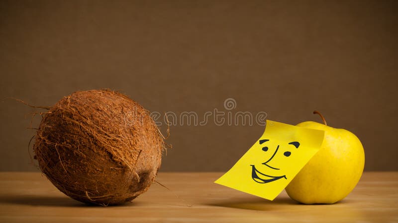 Apple with Post-it Note Smiling at Coconut Stock Image - Image of ...