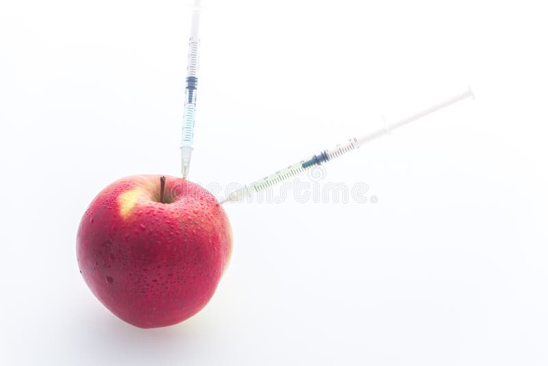 Apple with Punched Needles and Syringes As a Concept for Modifying Food ...