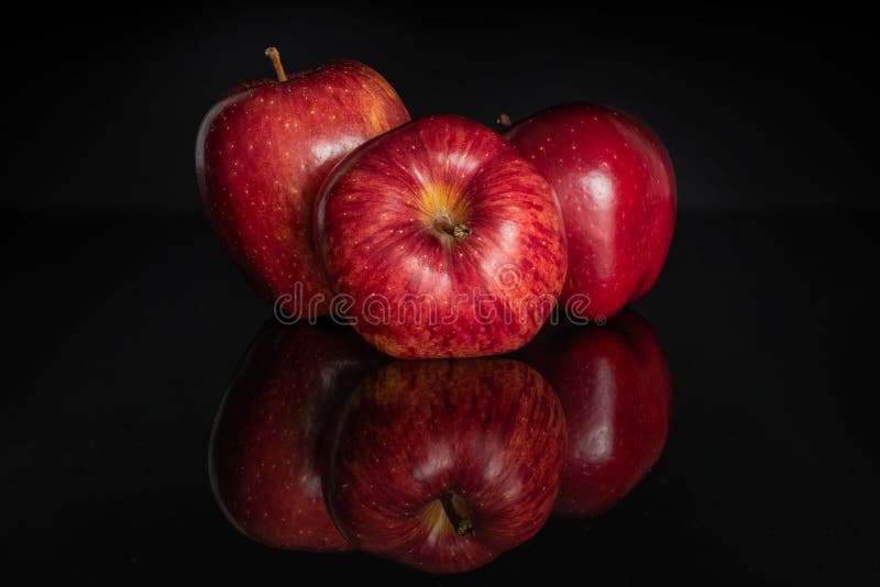 Apple Red Delicious Isolated on Black Glass Stock Image - Image of ...