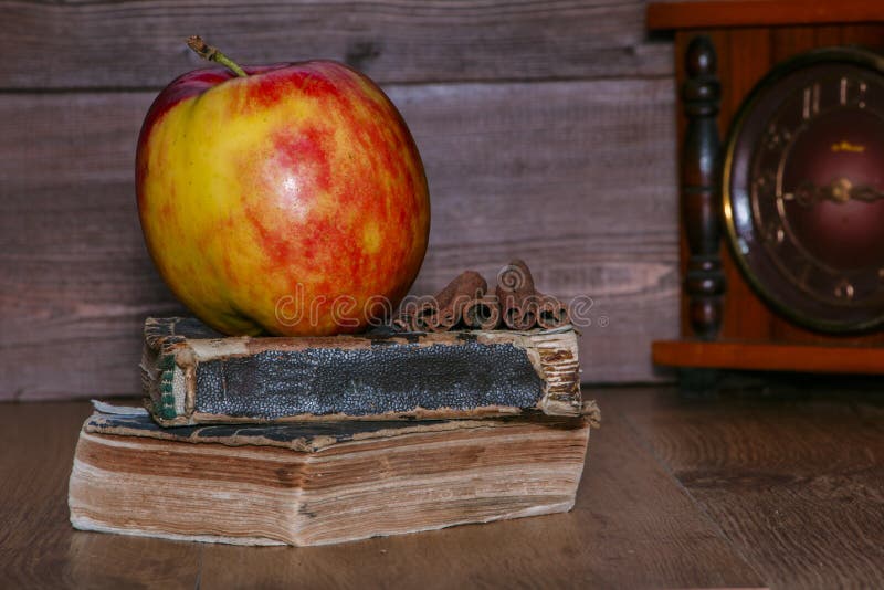Apple is Red on a Pile of Old Books. Stock Photo - Image of apple ...