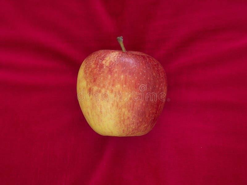 Apple on Red Velvet Cushion, Temptation or Luxury, with Copyspace ...