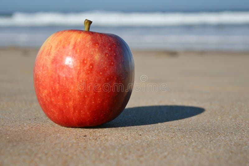 Apple on sand stock photo. Image of sunlight, healthy - 18244114