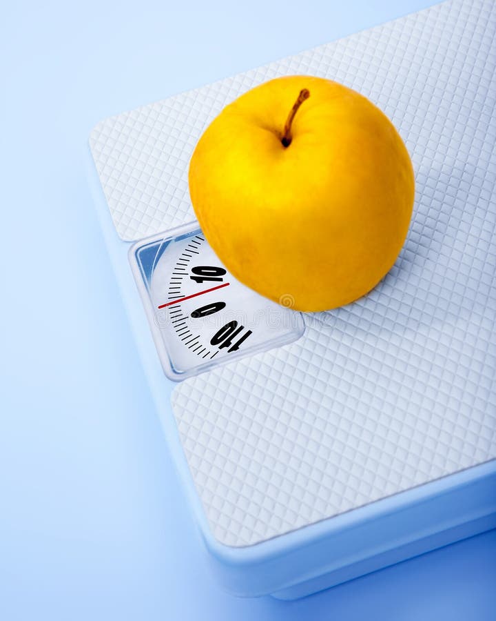 Apple on scale stock photo. Image of heavy, health, loss - 27448960