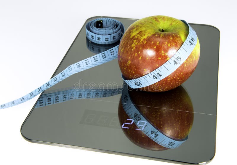 Apple on the scale. stock image. Image of conceptual - 39285003