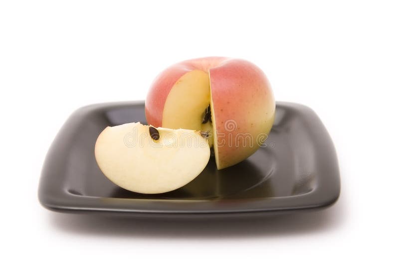 Apple and Segment on a Plate Stock Image - Image of background ...