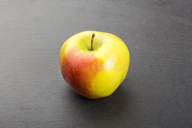 Apple on a slate stock image. Image of fruit, yellow - 78034449