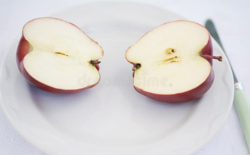 An Apple Sliced in Half stock image. Image of core, natural - 5577685