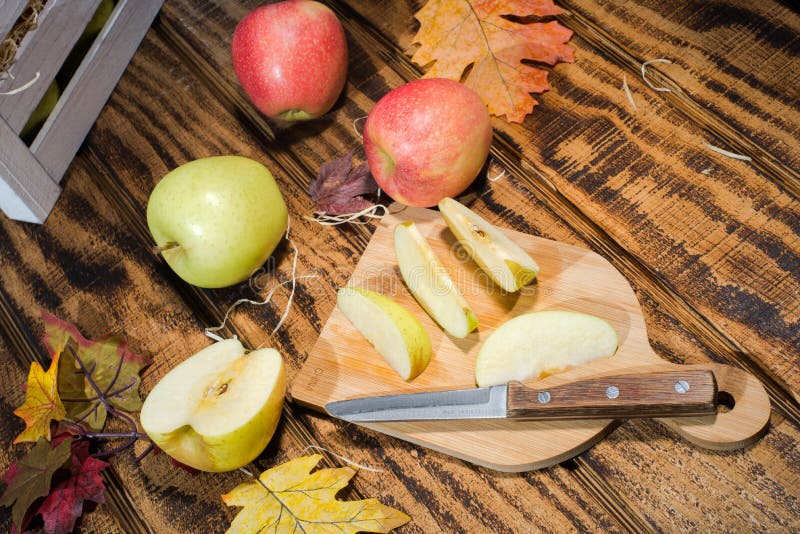 Apple Slices on a Cutting Board Apples in a Wooden Box Stock Image ...