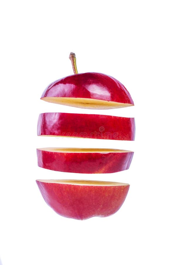 Apple Slices Flying in the Air Isolated on White Background Stock Photo ...