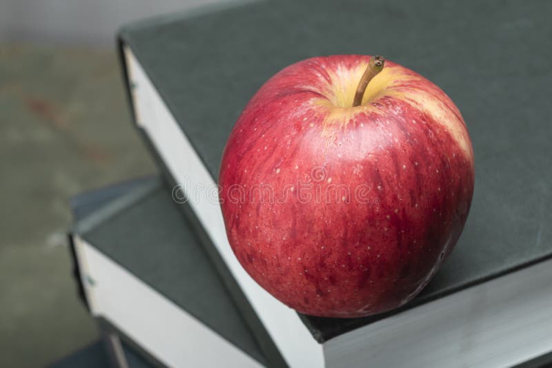 Apple on Stack of Book on Green Wood Table Study Stock Image - Image of ...