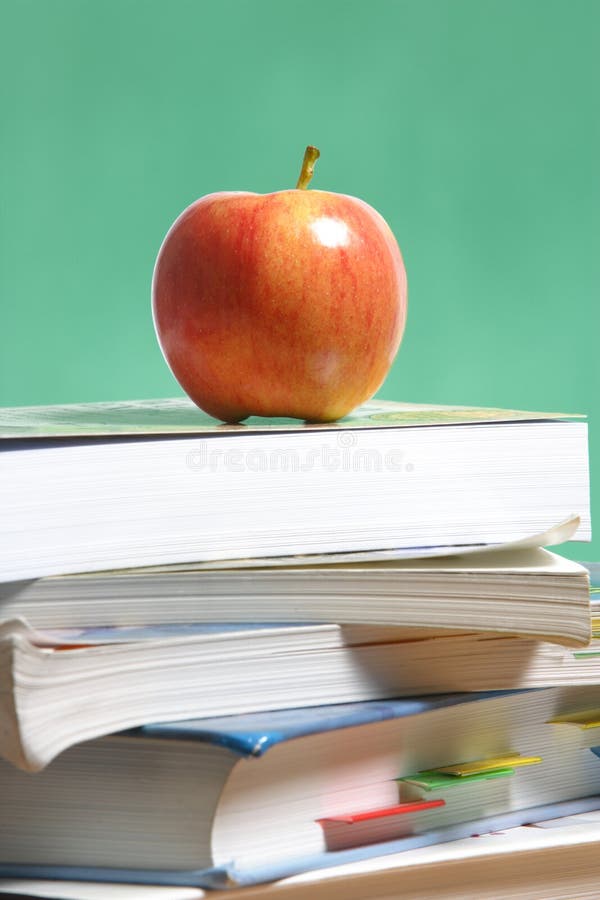Apple on Stack of Books in Classroom Stock Photo - Image of books ...