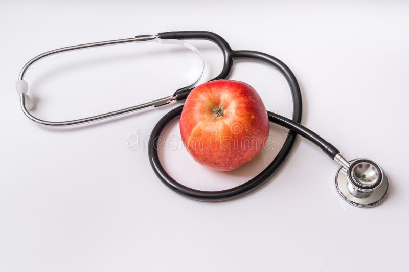 Apple with stethoscope stock photo. Image of stethoscope - 21916018