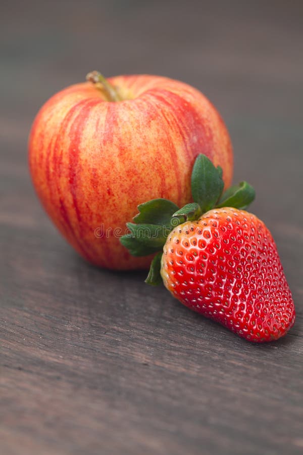 Apple and Strawberry on a Wooden Surface Stock Image - Image of fruit ...