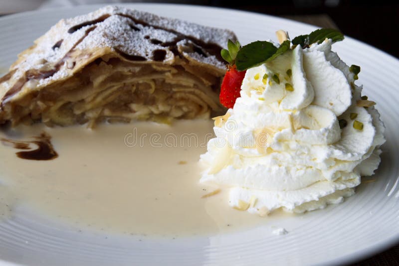 Apple strudel with cream stock photo. Image of pastry - 18919856