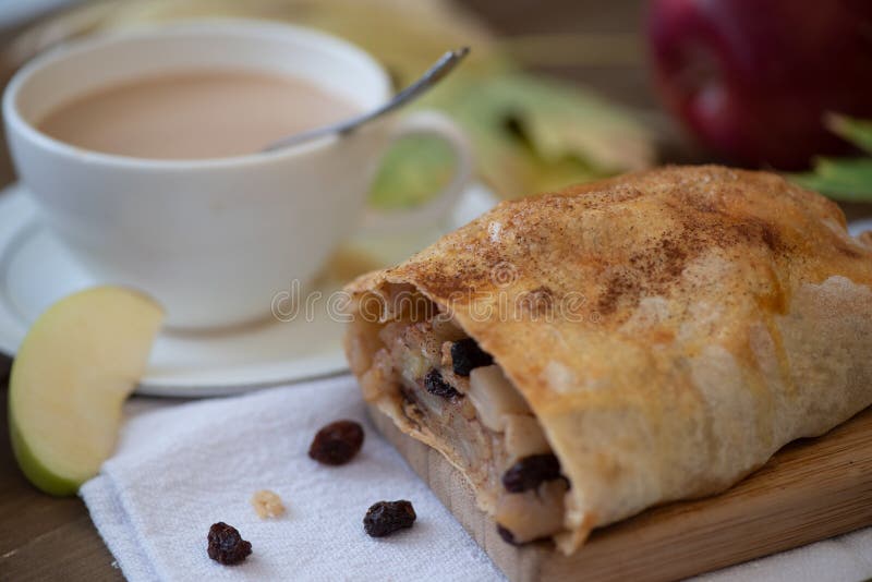 Apple Strudel from the Side with Coffee and Milk Stock Image - Image of ...