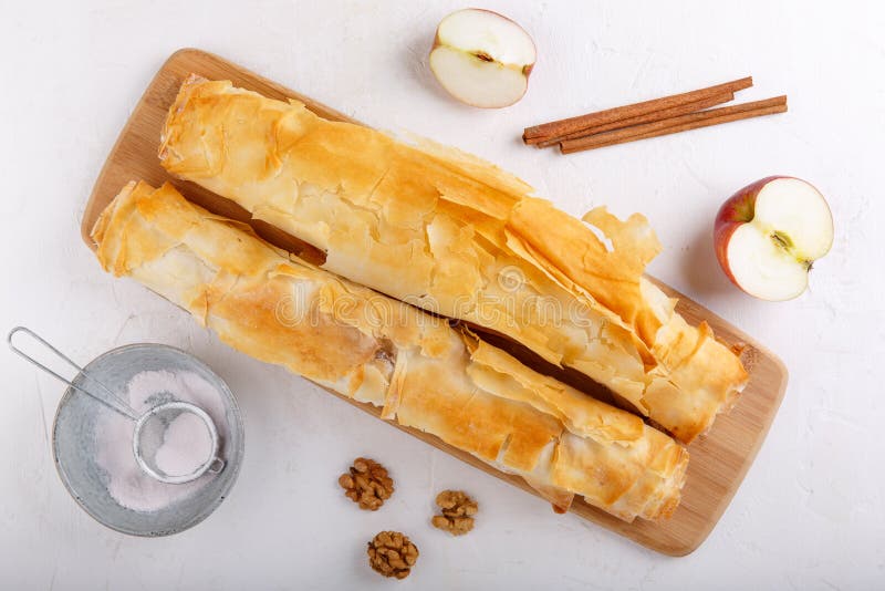 Apple Strudel on White Table. Homemade Pie with Apples, Walnuts and ...