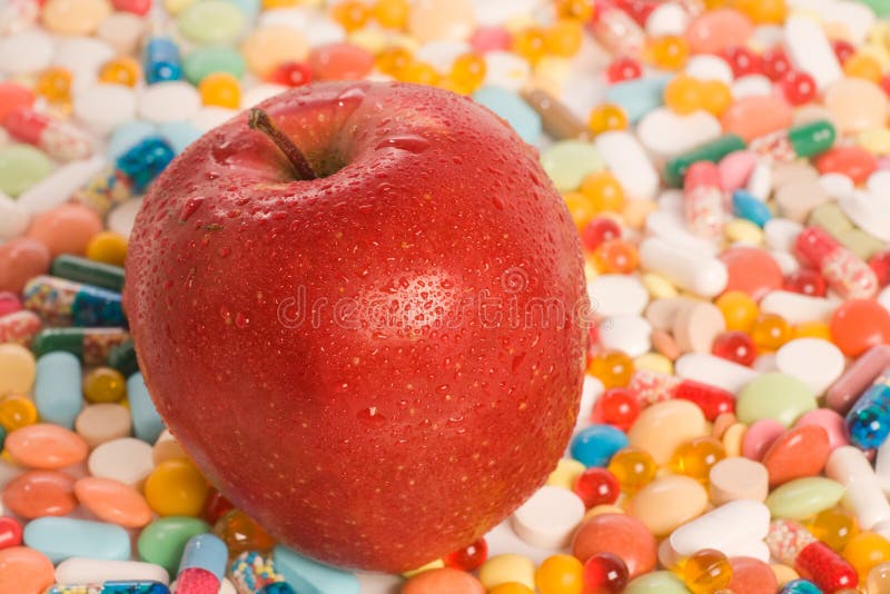 Red apple vs. pills stock photo. Image of capsules, colour - 4740952