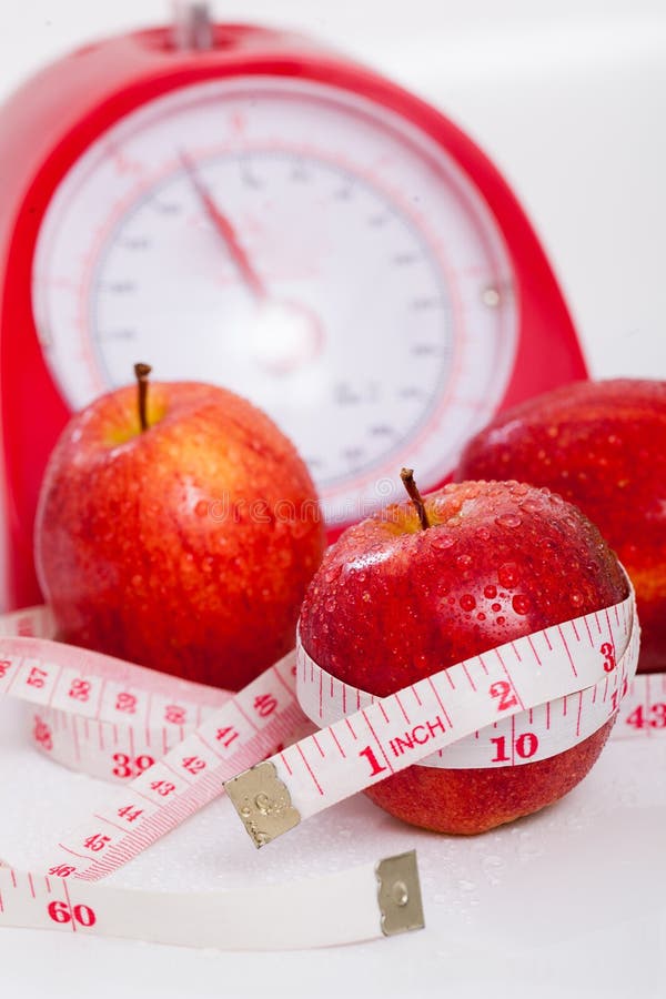 Apple with tape stock image. Image of fruit, weight - 115987957