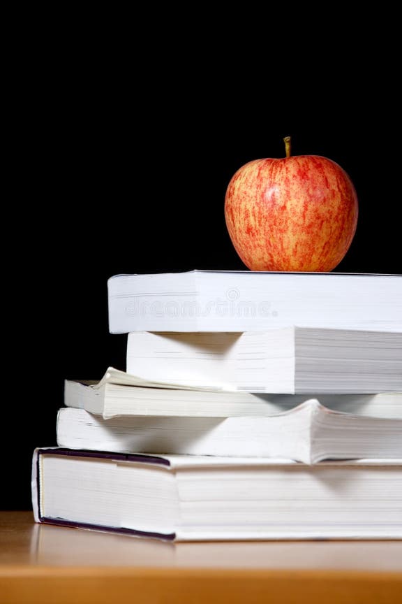An Apple on Top of a Stack of Books Stock Image - Image of class, data ...