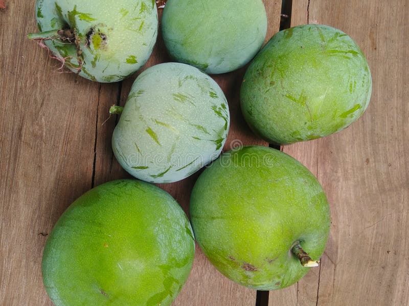 Apple Type Mango on a Wooden Board Stock Image - Image of apple, mango ...