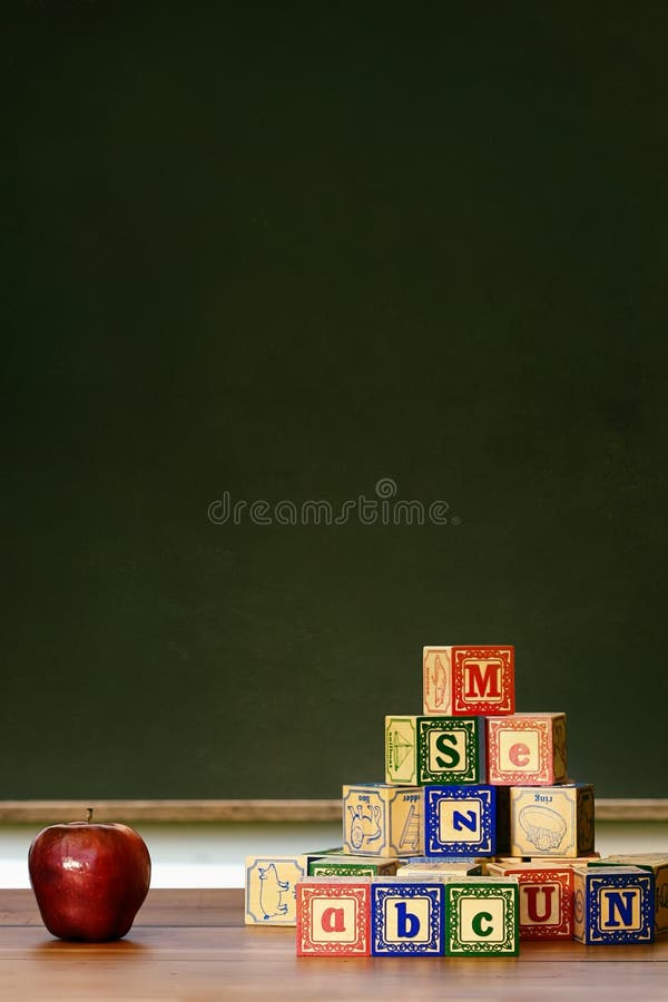 Apple and wooden blocks stock photo. Image of chalkboard - 96936986
