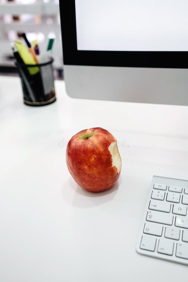 Apple at work office stock image. Image of hand, coffee - 165293435