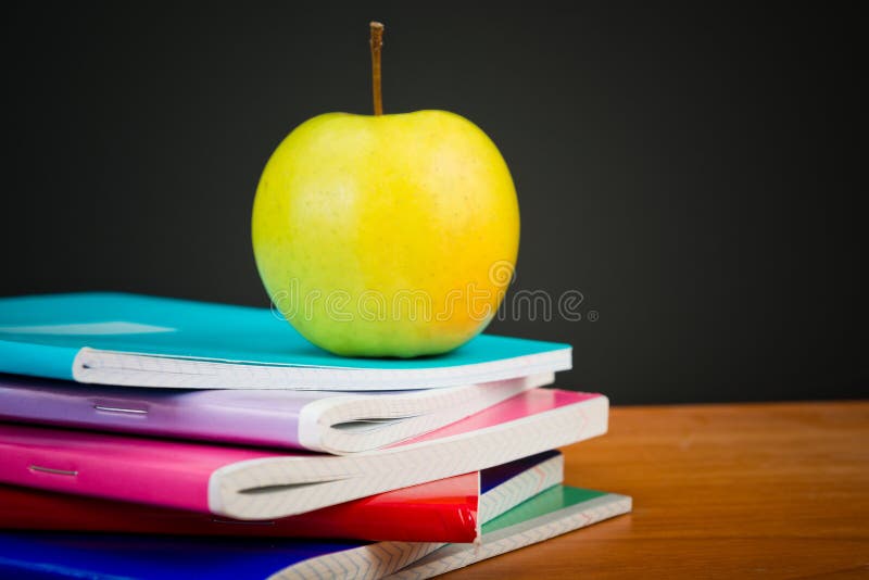 Apple on writing-books stock photo. Image of materials - 32921248