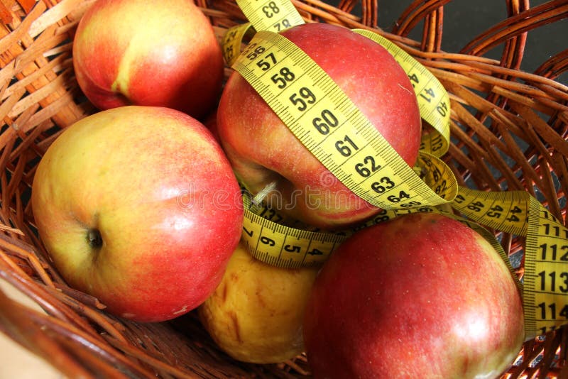 Apples with measuring tape stock image. Image of figure - 41757237