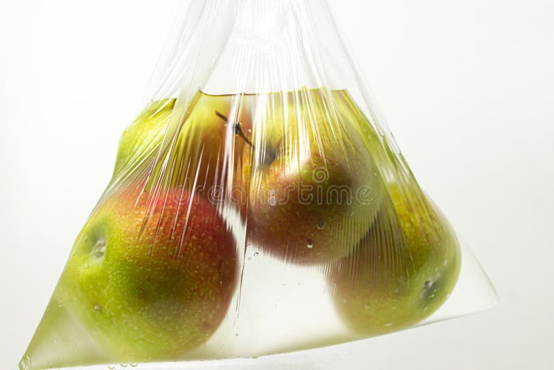 Apples in a Plastic Bag with Water on a White Background. Stock Photo ...