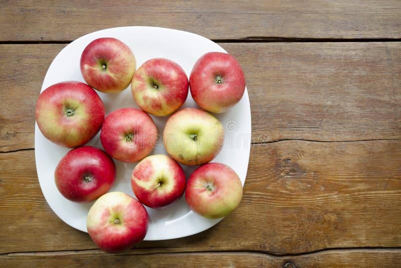 Apples on plate stock image. Image of juicy, healthy - 34795867