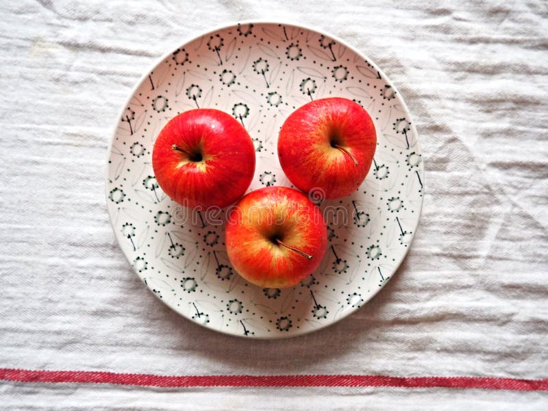 Apples on a plate stock image. Image of stripe, november - 78475313