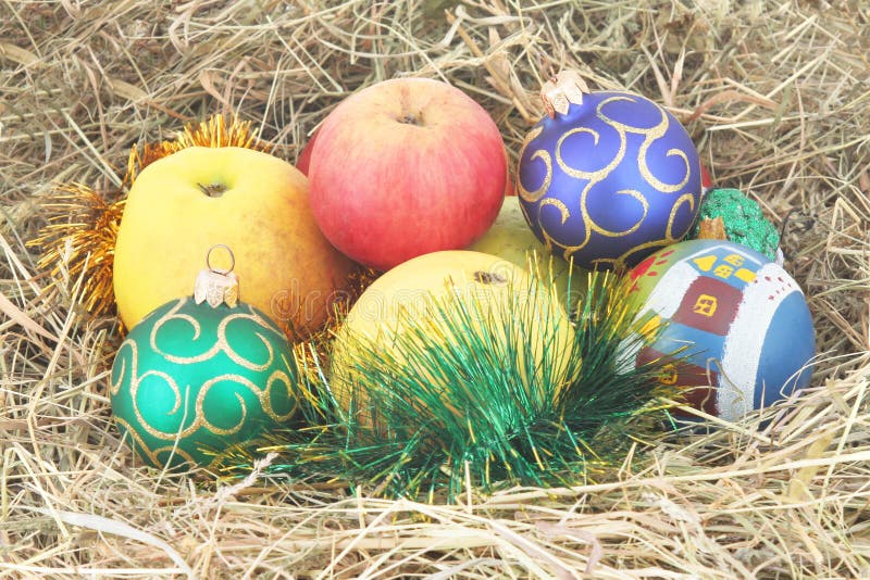 Apples and toys at hay stock image. Image of fresh, season - 12024529
