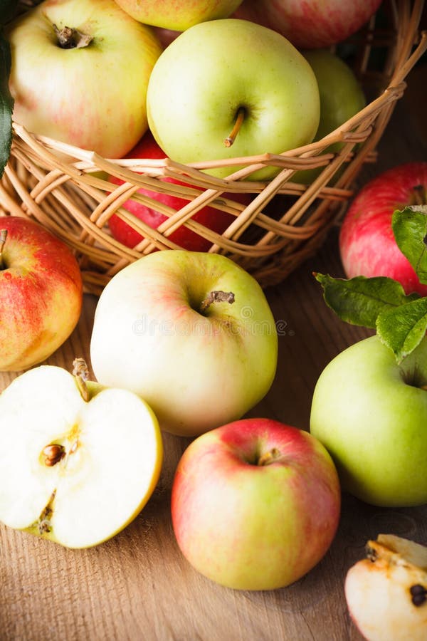 Apples on wooden table stock image. Image of life, bowl - 20844873