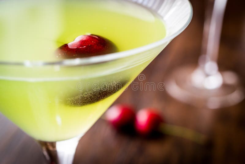 Appletini Cocktail with Cherry on Wooden Surface. Stock Photo - Image ...
