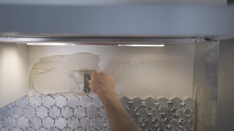 The Process of Applying the Adhesive Solution with a Metal Spatula on ...