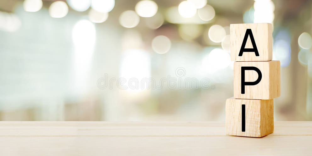 Application Programming Interface, API Word on Wooden Blocks Over Blur Backgroind with Copy ...