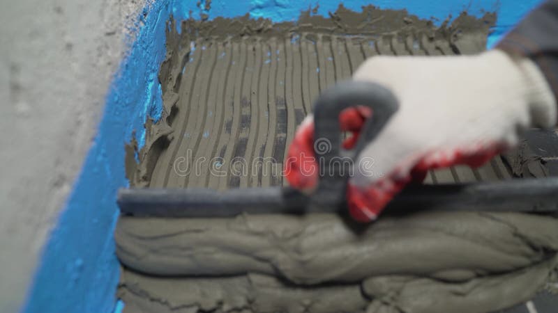 Laying Ceramic Floor Tiles, Applying an Adhesive Base. Application of a ...