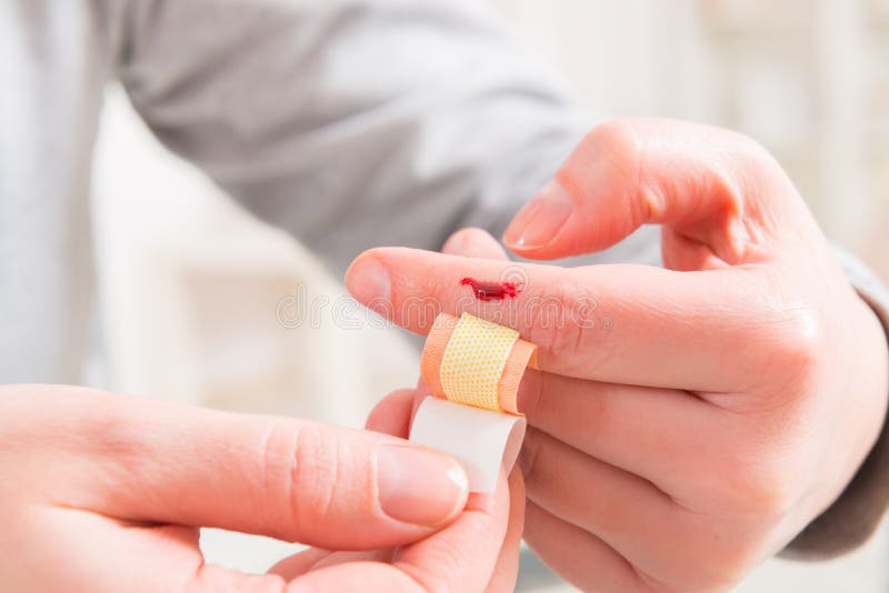 Applying Adhesive Bandage on Finger Stock Photo - Image of protection ...