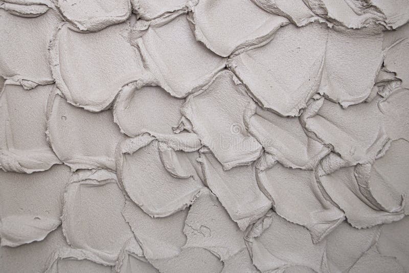 Applying Cement Plaster in a Thick Layer on a Concrete Wall by a ...