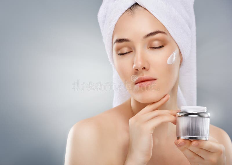 Applying cosmetic cream stock photo. Image of model, skincare - 47917978