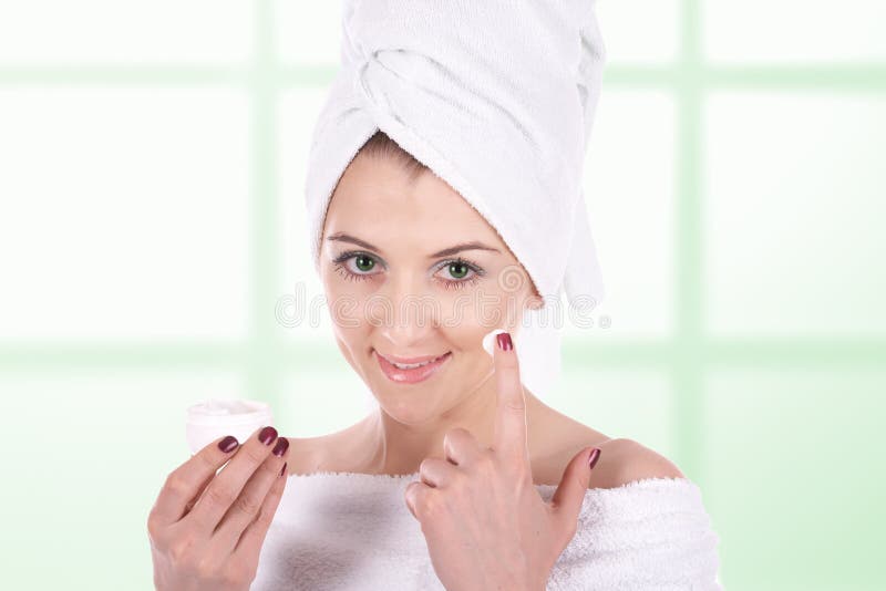 Applying cream stock image. Image of female, skin, carefree - 14764361