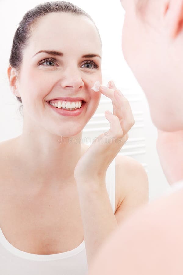 Woman Applying Cream on Her Face Stock Image - Image of mask, hand: 5883081