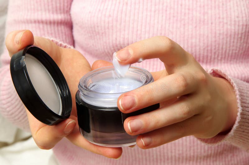 Applying cream stock image. Image of female, feminine - 38899581