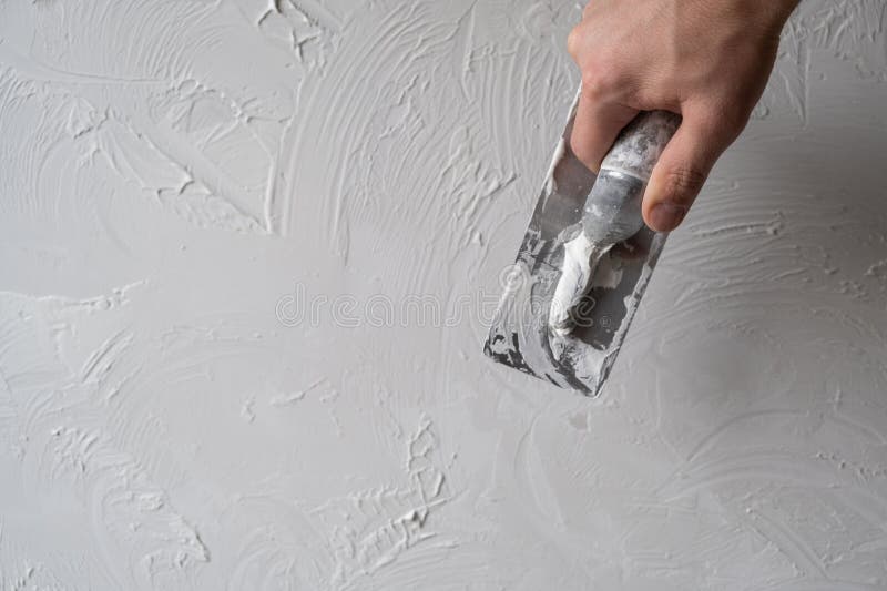 Applying Decorative Putty. White Abstract Texture of Surface Covered ...