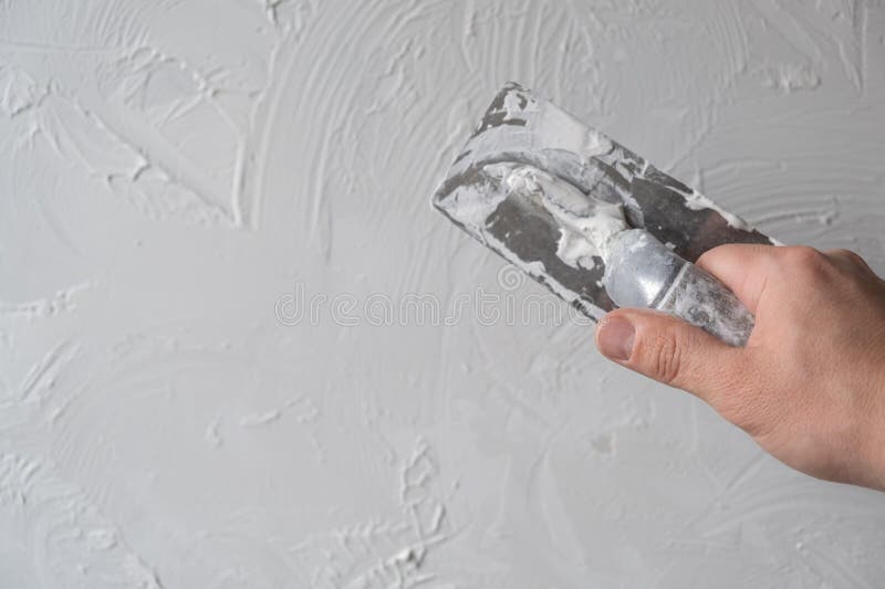 Applying Decorative Putty. White Abstract Texture of Surface Covered ...