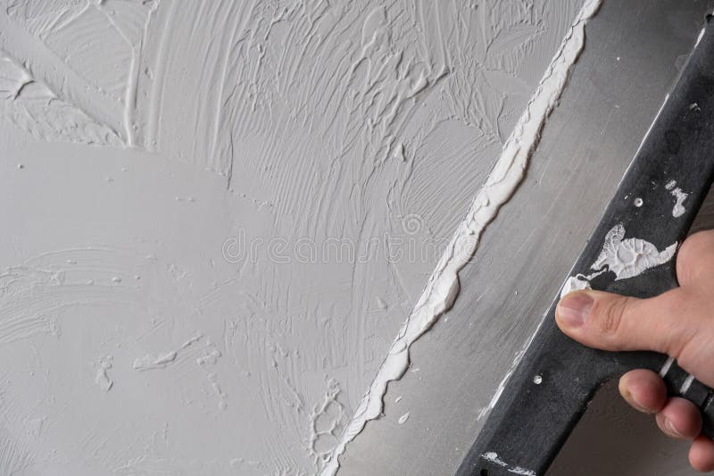 Applying Decorative Putty. White Abstract Texture of Surface Covered ...